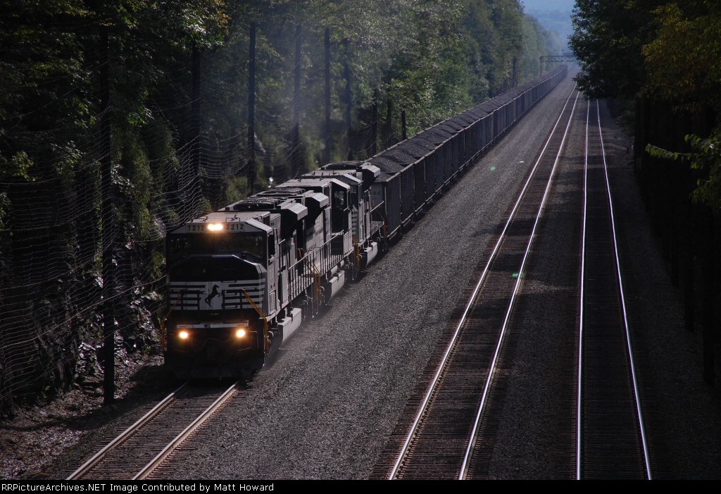 Three SD80MAC's struggle east with another loaded coal train.